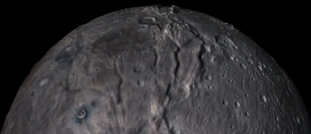 Image of the Day NASA flies over Pluto's large moon Charon and captures ...